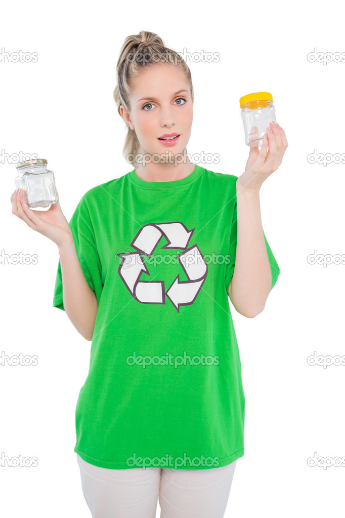 Peaceful environmental activist wearing recycling tshirt holding jars ...