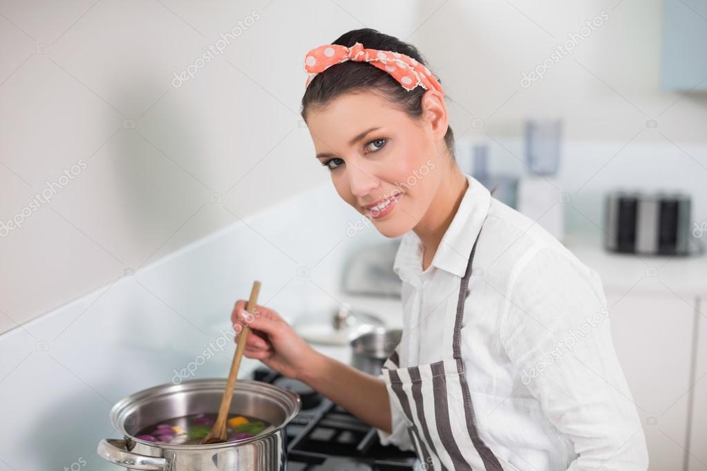 Happy gorgeous cook posing Stock Photo by ©lightwavemedia 33422345