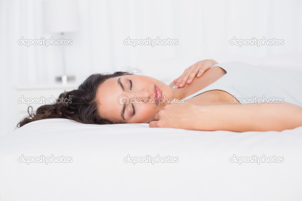 Pretty young woman sleeping with eyes closed in bed — Stock Photo © lightwavemedia #37835125
