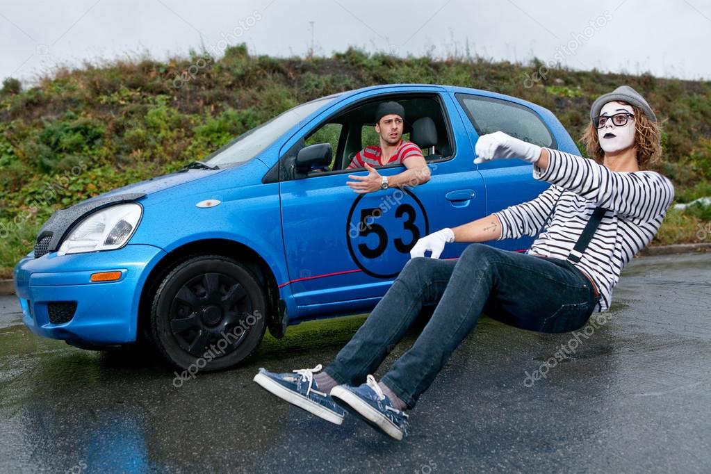 Mime artist waiting at a red light in an invisible car – Stock ...