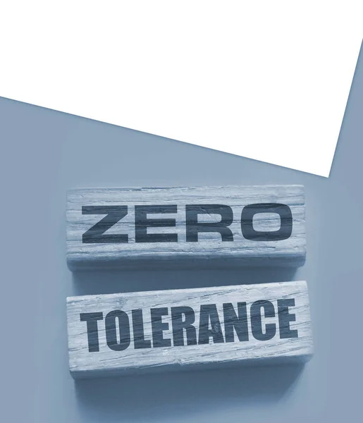 Zero tolerance - words from wooden blocks with letters, severely ...