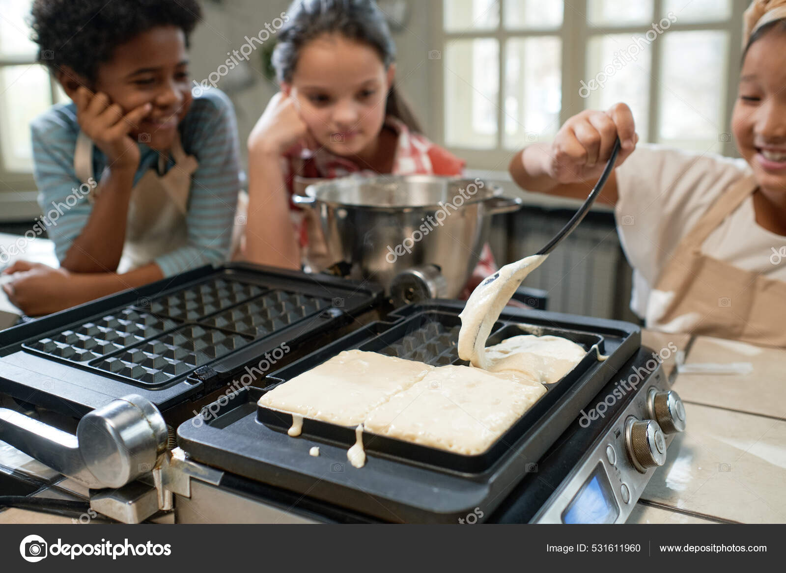 Little girl baking waffles with friends — Stock Photo © annas.stills ...