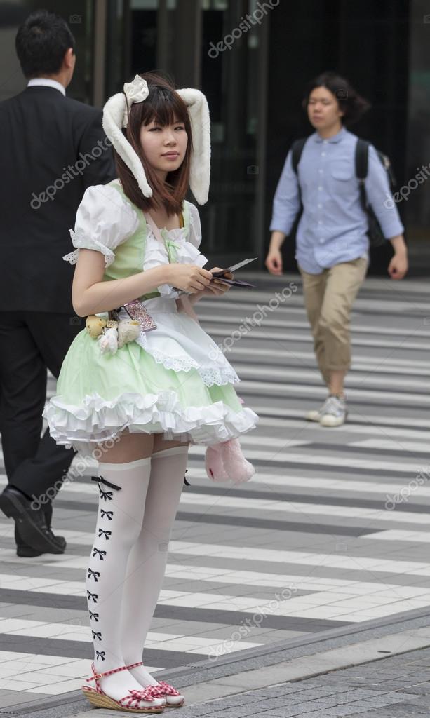 A girl advertising cosplay hostess bar in Tokyo — Stock Editorial Photo ...