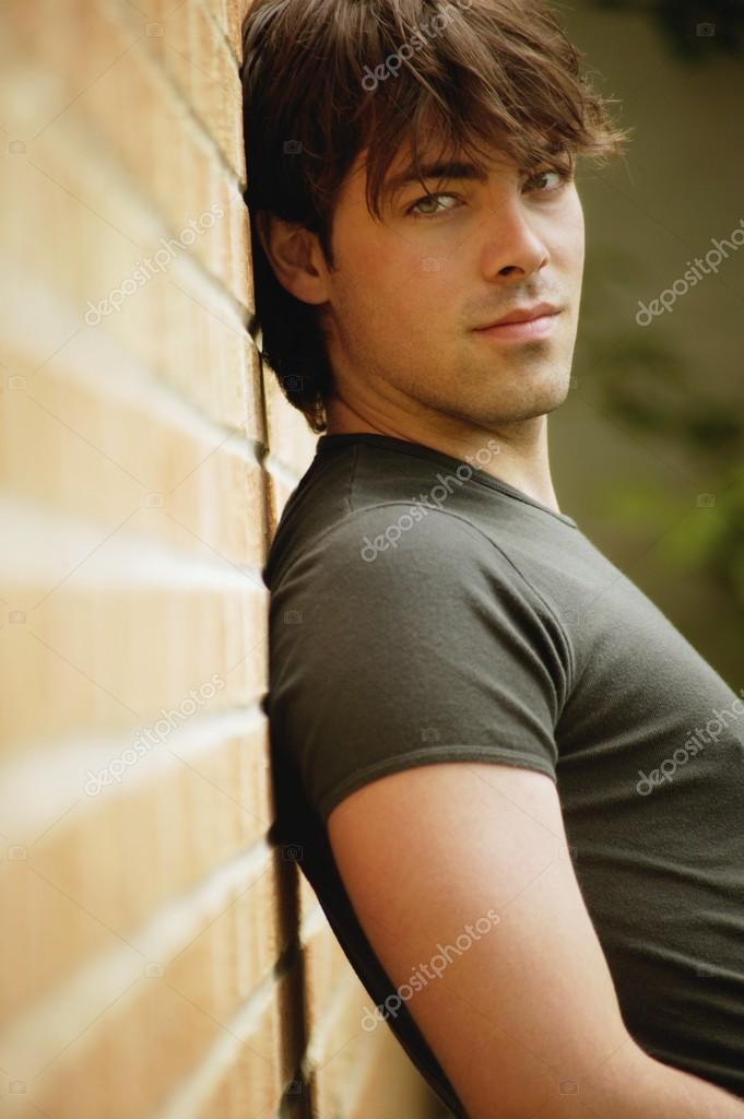 Man Leaning Against Wall — Stock Photo © DesignPicsInc #31602709