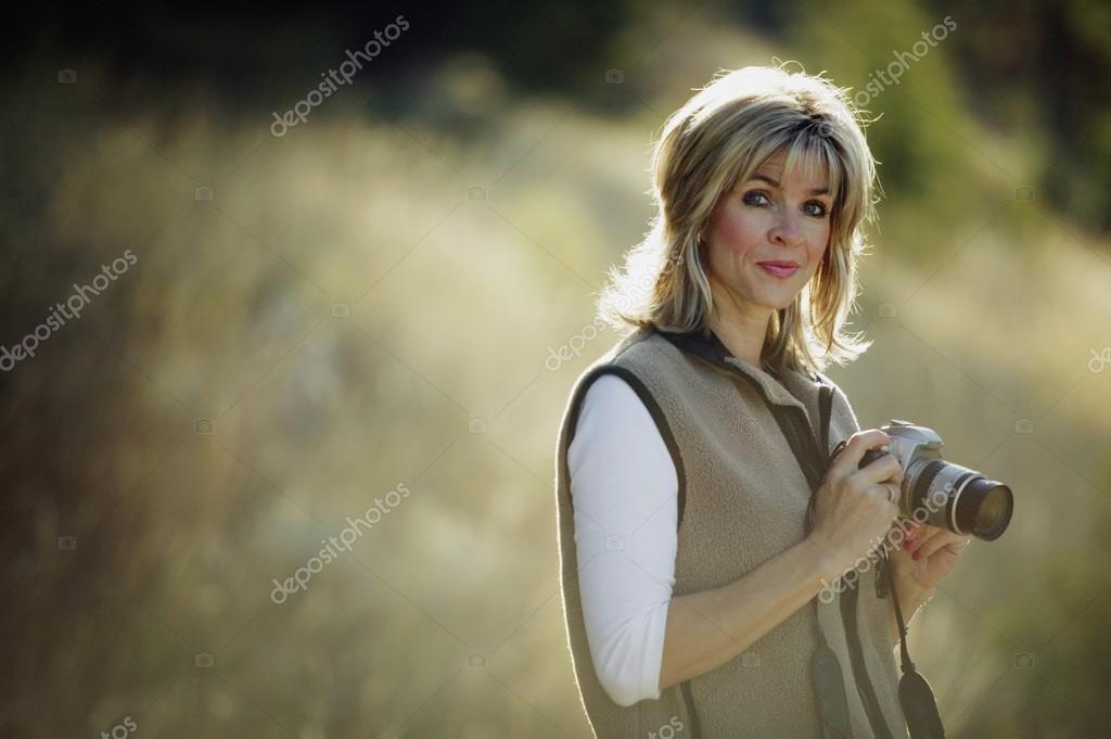 Woman With Camera Stock Photo by ©DesignPicsInc 31608301