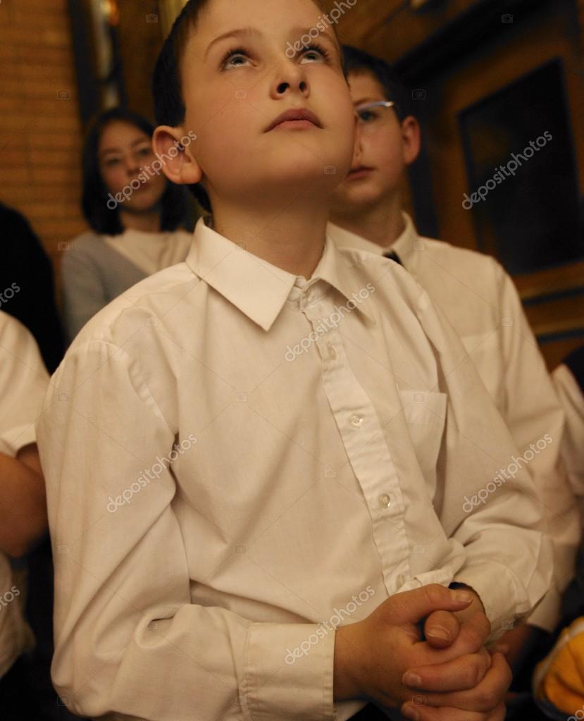 Young Boy Praying — Stock Photo © DesignPicsInc #31623707