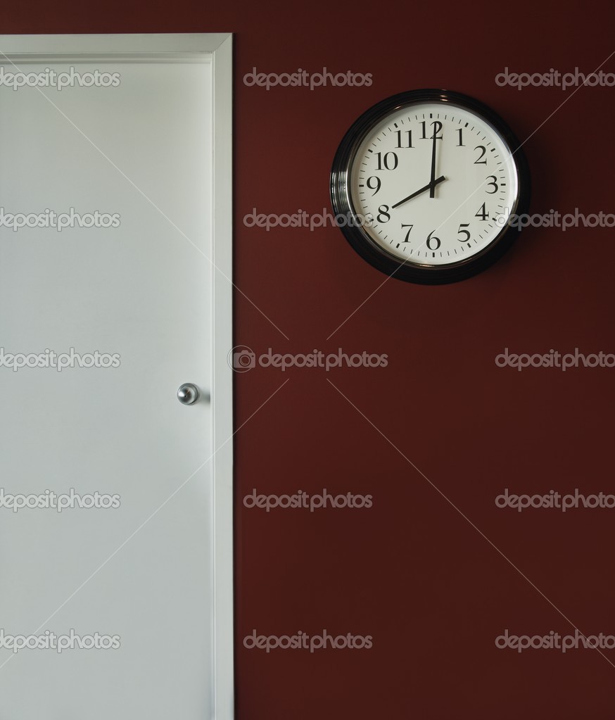 A Wall Clock Showing 8 O'clock — Stock Photo © DesignPicsInc #31624083