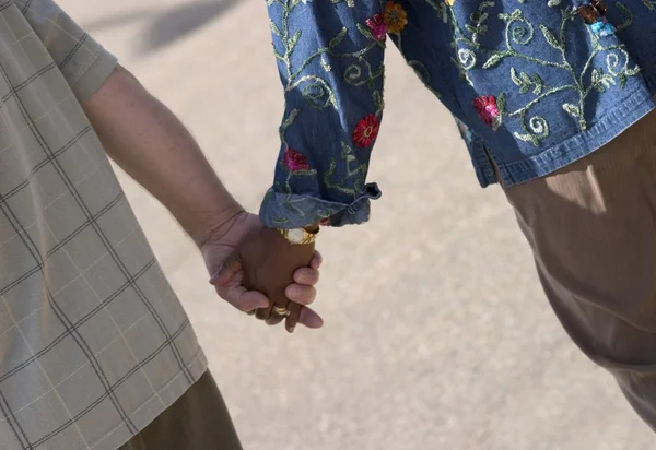 The couple hand in hand Stock Photos, Royalty Free The couple hand in ...