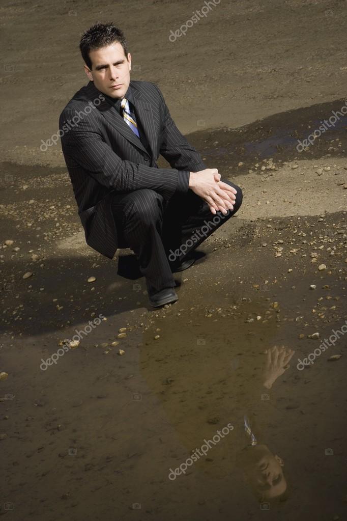 Native American Man Crouched Down ⬇ Stock Photo, Image by ...