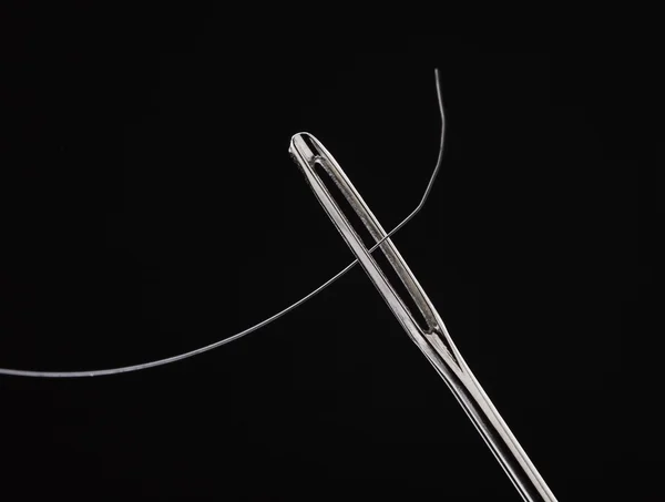 Thread Through Eye Of Needle Stock Photo by ©DesignPicsInc 31720999