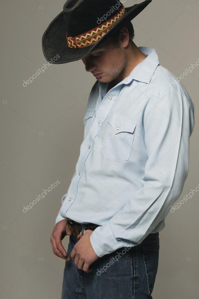 Wearing Cowboy Hat Looking Down