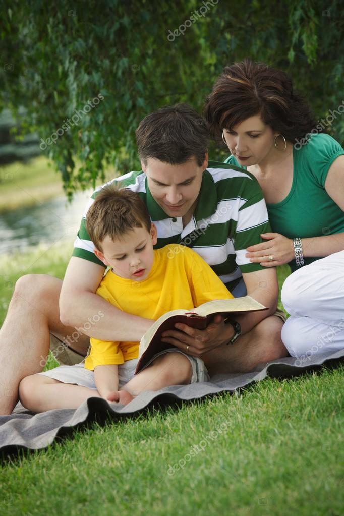 Family Reading Together — Stock Photo © DesignPicsInc #31763353