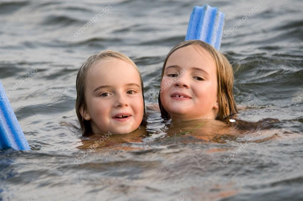 Girls Swimming In A Lake