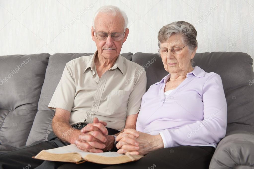 Elderly Couple Having Worship With The Bible Stock Photo by ...