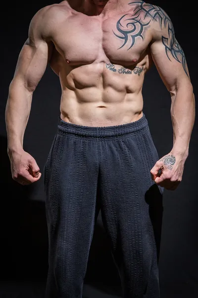 Bodybuilder with tattoos Stock Photo by ©aallm 51159607