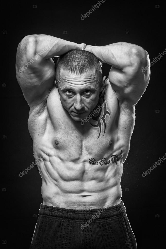 Muscle man with tattoos — Stock Photo © aallm #46624731