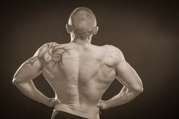 Muscle man with tattoos - Stock Image - Everypixel