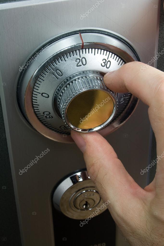 Fingers Turning Combination Lock — Stock Photo © Fireflyphoto #31920061