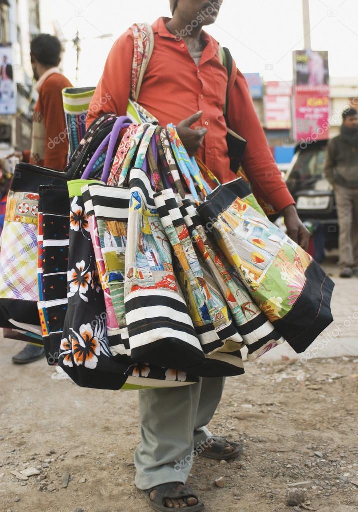 Vendor selling bags in a street market — Stock Editorial Photo ...