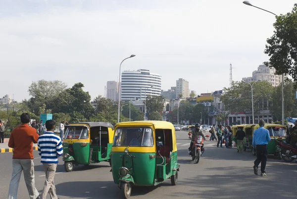 Auto rickshaw driving on road, delhi, india – Stock Editorial Photo ...