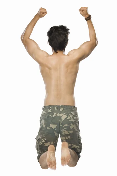 Shirtless man jumping Stock Photos, Royalty Free Shirtless man jumping ...