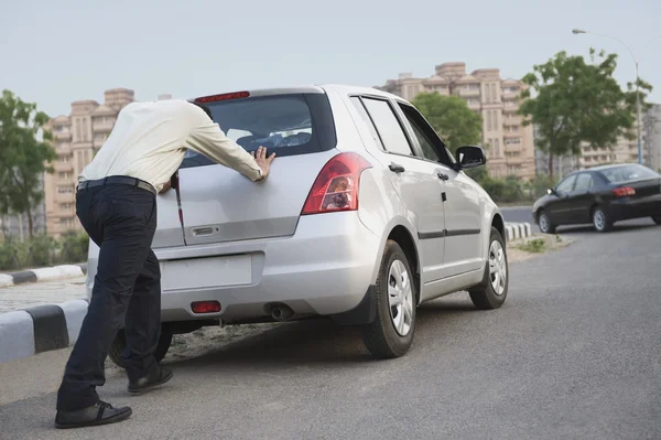Man pushing his car Stock Photos, Royalty Free Man pushing his car ...
