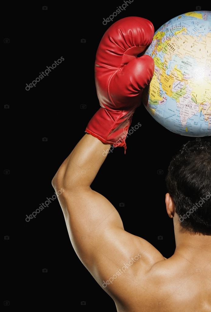 Male boxer holding a globe over his head Stock Photo by ©imagedb_seller ...