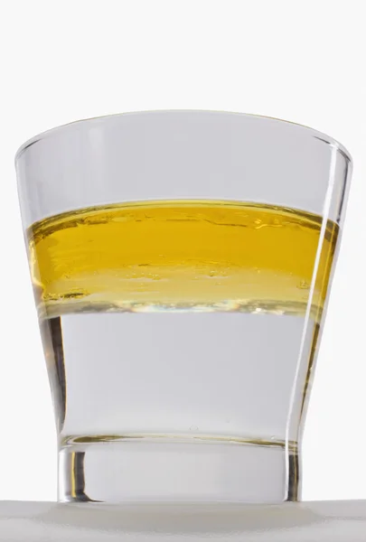 Oil floating on water surface in a glass — Stock Photo © imagedb_seller ...