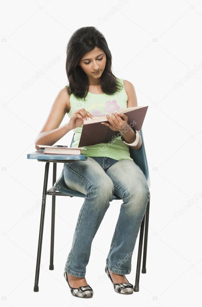 Student reading a book in a classroom — Stock Photo © imagedb_seller ...