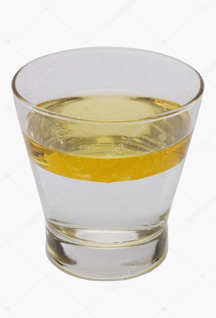 Oil floating on water surface in a glass — Stock Photo © imagedb_seller ...