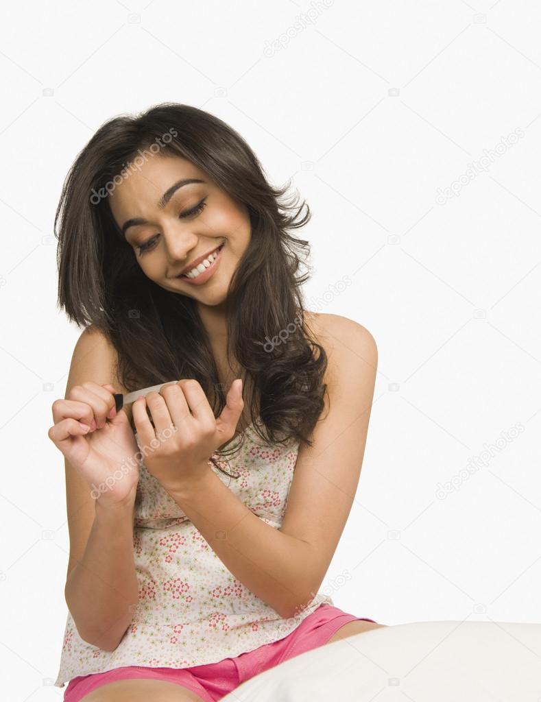 Woman filing her fingernails — Stock Photo © imagedb_seller #33027623