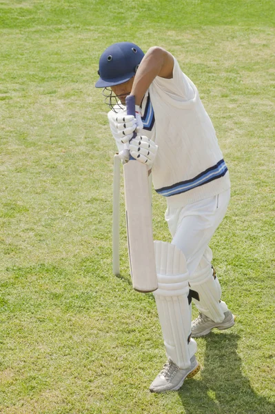Cricket batsman playing a defensive stroke — Stock Photo © imagedb ...
