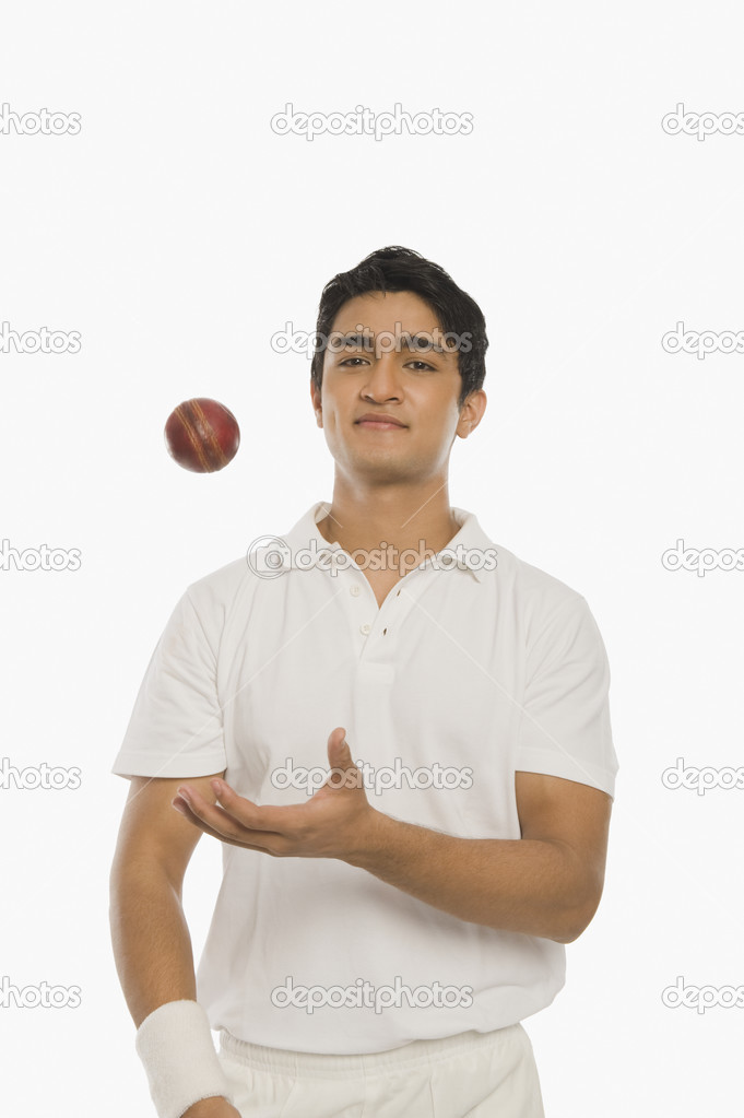 Bowler tossing a cricket ball Stock Photo by ©imagedb_seller 33037749