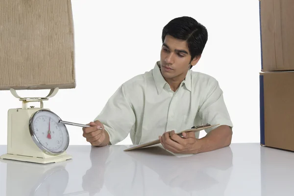 Weigh the weight of the package Stock Photos, Royalty Free Weigh the ...