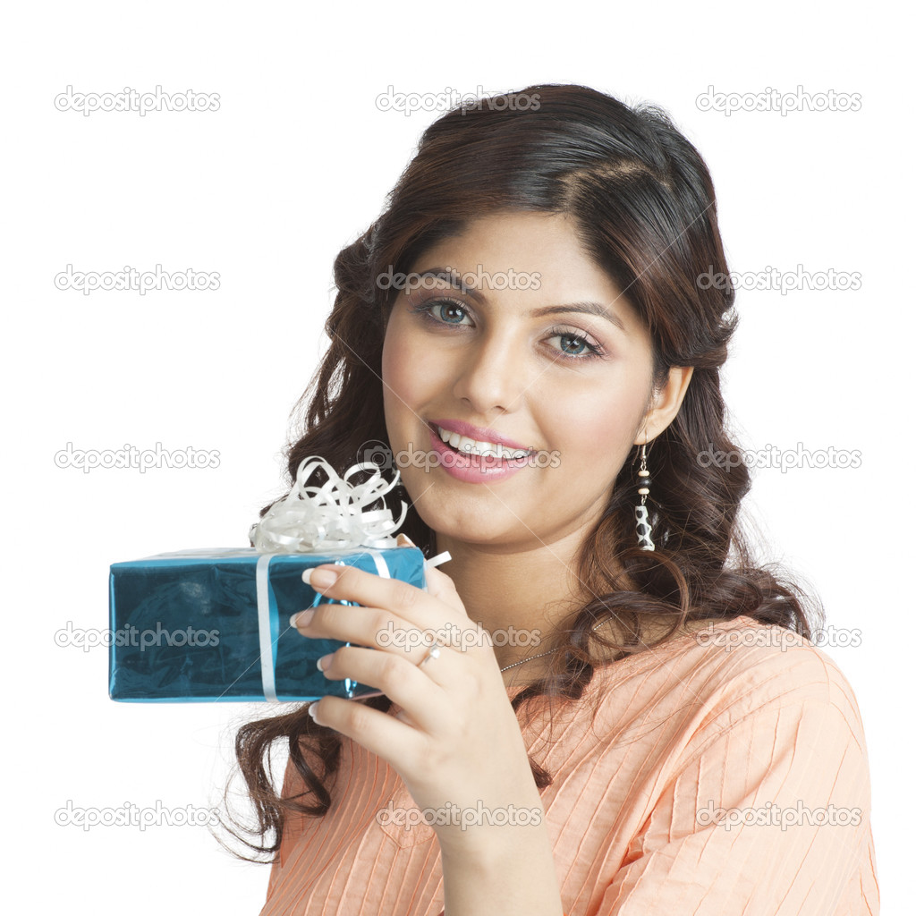 Woman holding a gift box Stock Photo by ©imagedb_seller 33108075