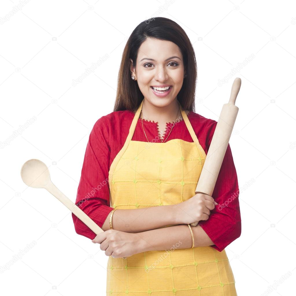 Woman holding a rolling pin and ladle — Stock Photo © imagedb_seller ...