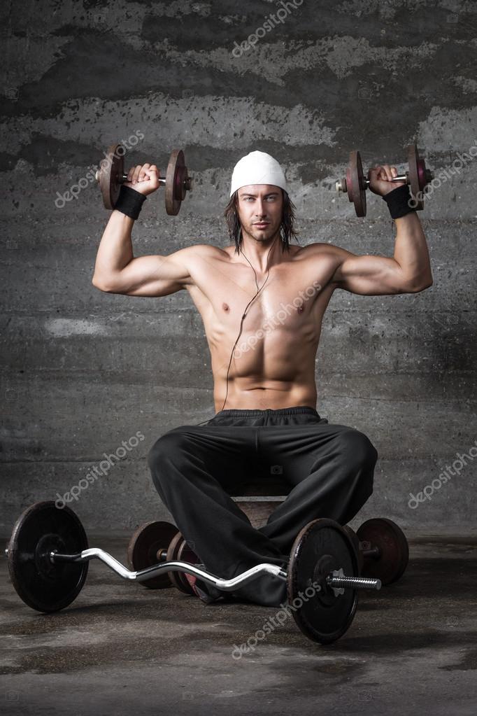 Handsome bodybuilder working out Stock Photo by ©alessandroguerr 31405205