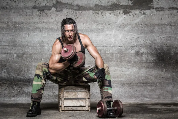 Aggressive muscle man lifting weights - Stock Image - Everypixel