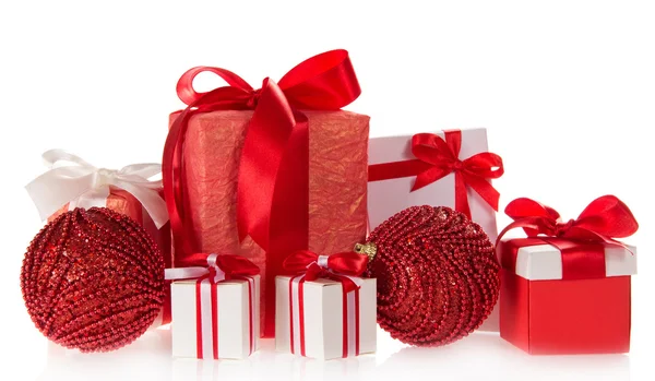 Gift boxes with tapes and bows, the spheres decorated with beads ...