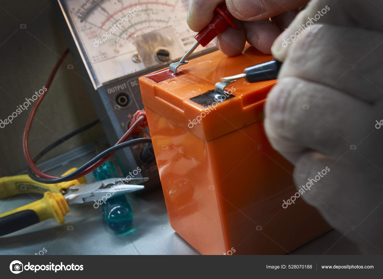 Hands Person Checking Battery Multimeter Stock Photo by ©Wirestock ...