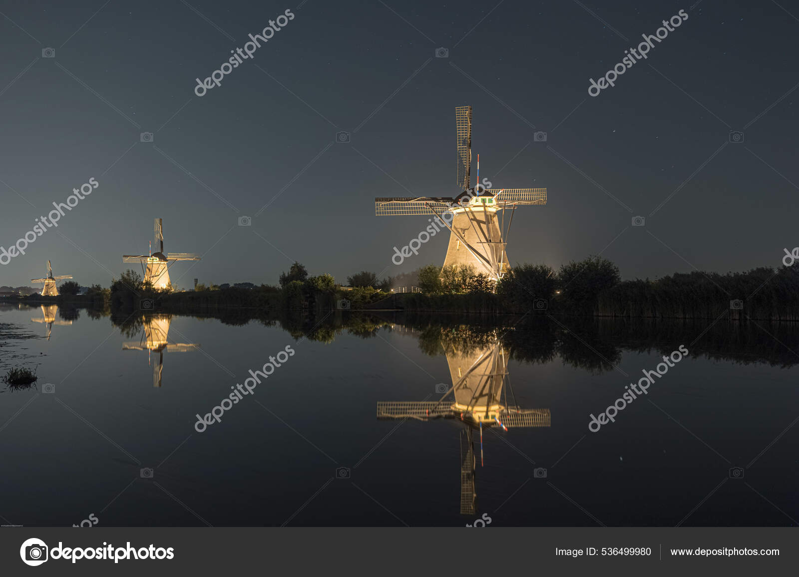 Illuminated Windmills Reflected Lake Night — Stock Photo © Wirestock ...