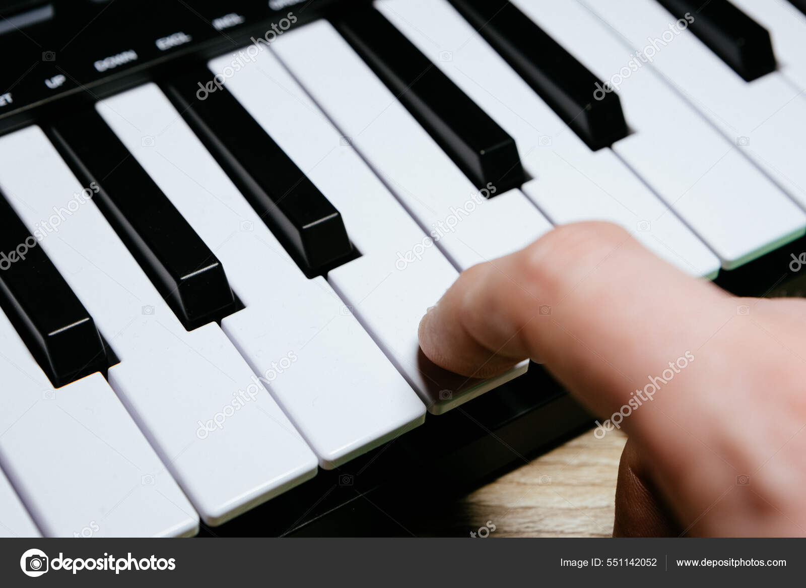 Hand Playing Piano Keys Stock Photo by ©Wirestock 551142052