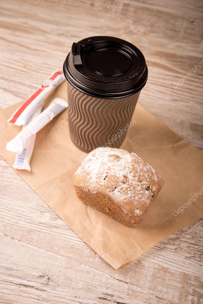 Coffee in a paper cup and fruitcake Stock Photo by ©nata-lunataD 48053671