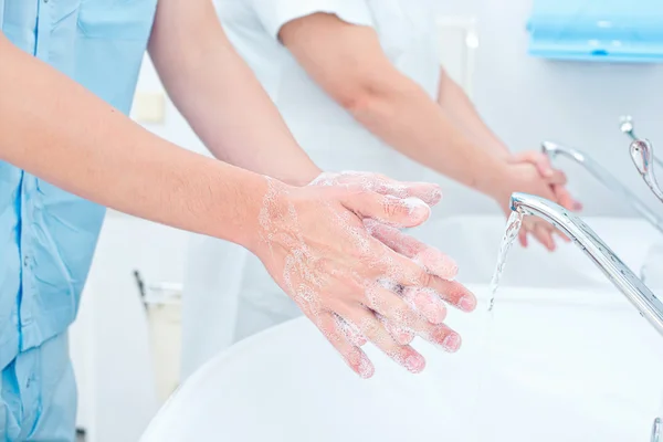 Surgeon washing hands before operation Stock Photo by ©nata-lunataD ...