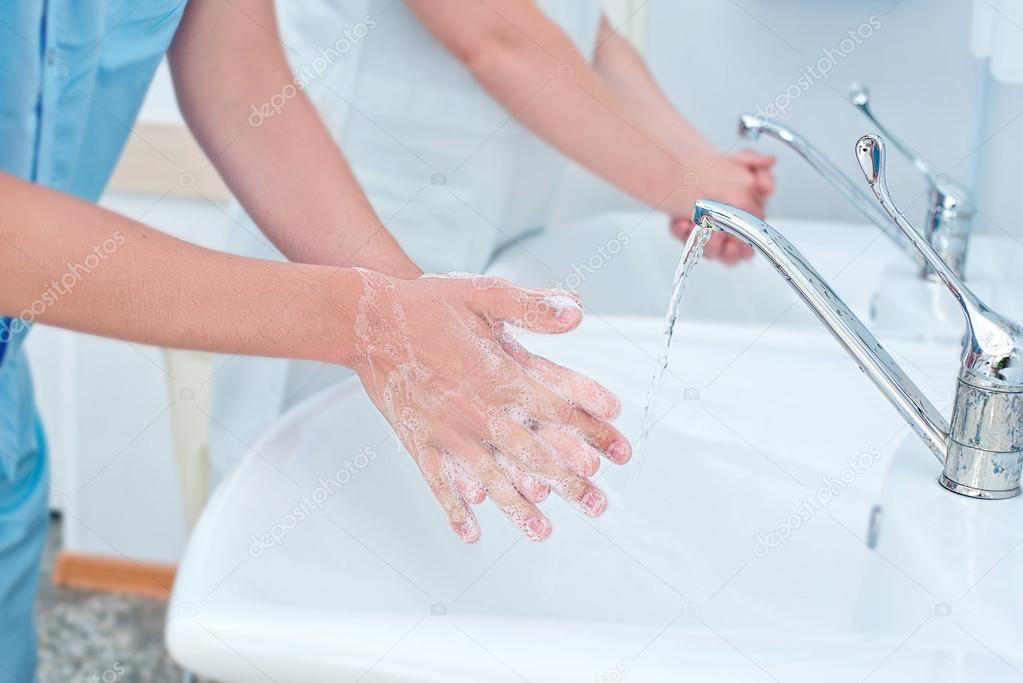 Surgeon washing hands before operation Stock Photo by ©nata-lunataD ...