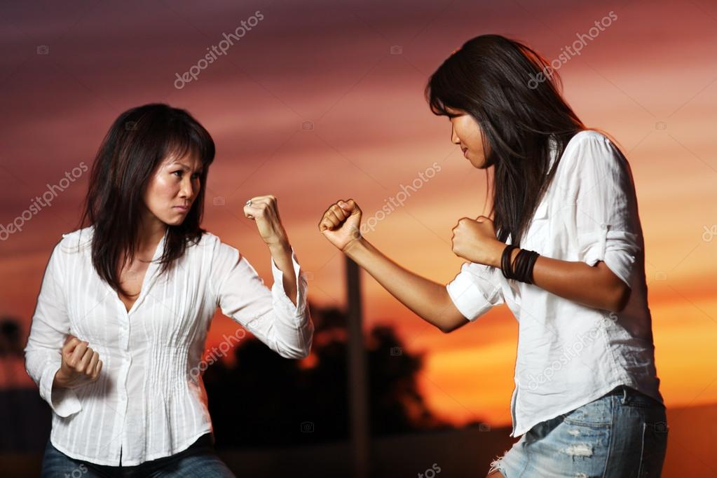 Two asian women fighting Stock Photo by ©logoboom 32422277