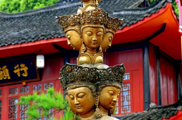 Emeishan, China: Column with Multiple Buddha Faces at Wan Nian Temple ...