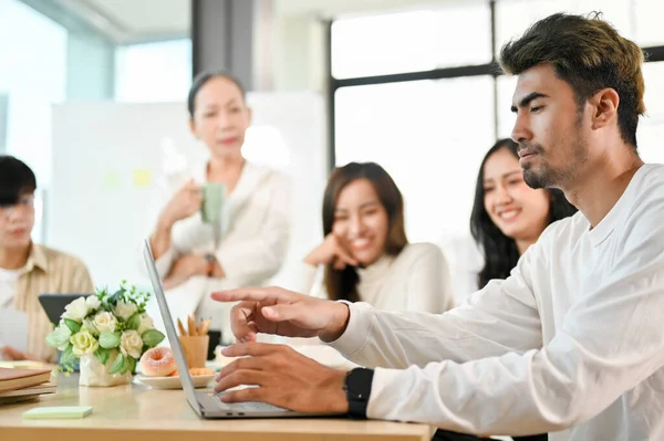 An Asian male web developer, graphic designer presented his ideas to ...