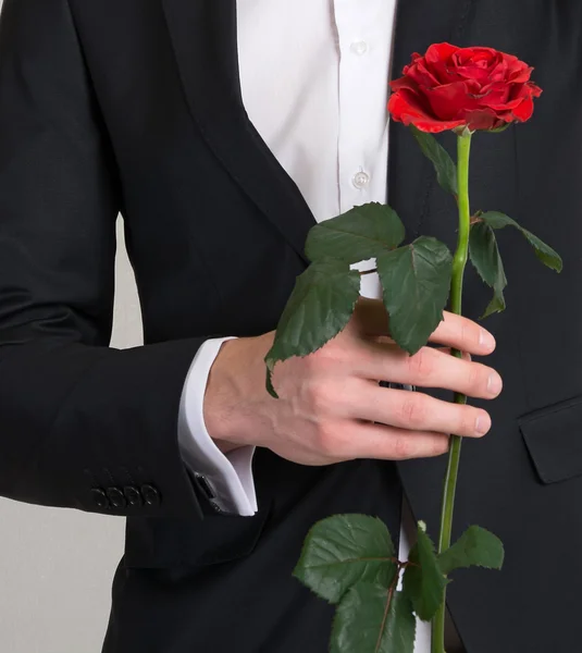 Man holding a rose — Stock Photo © phaendin #34851617