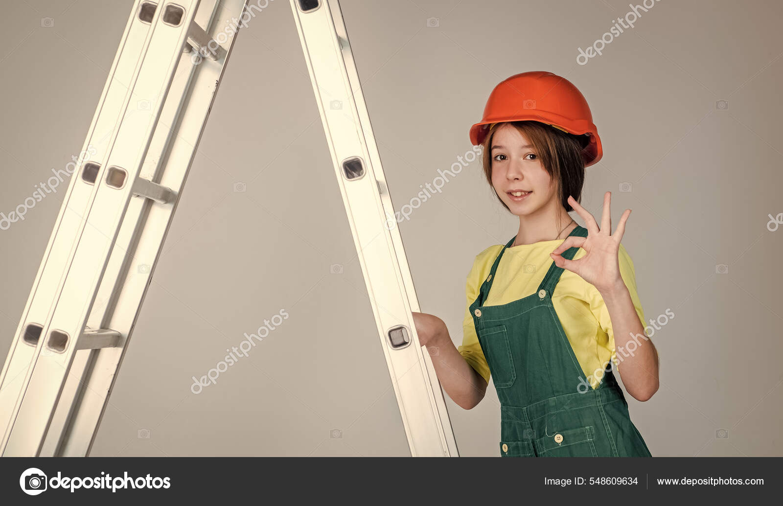 Girl in helmet plays builder. building and renovating. kid build ...